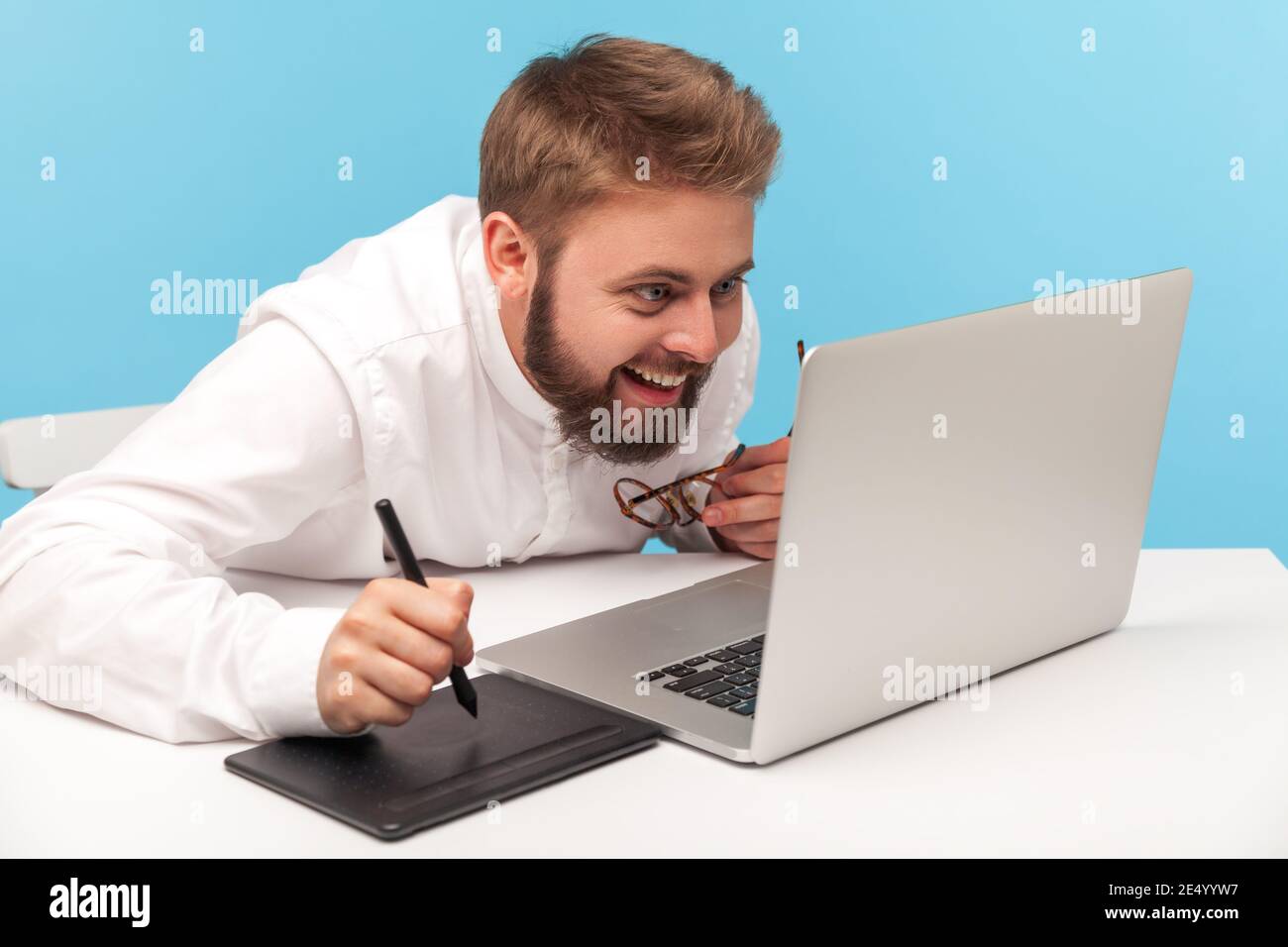 Male illustrator using laptop hi-res stock photography and images - Alamy