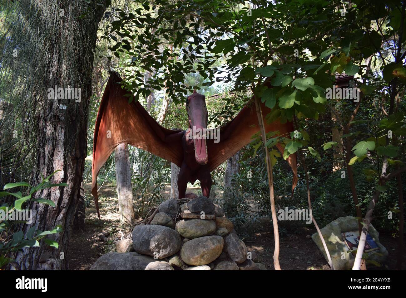 Feature one of the life-size sculpture of prehistoric animals, the ...