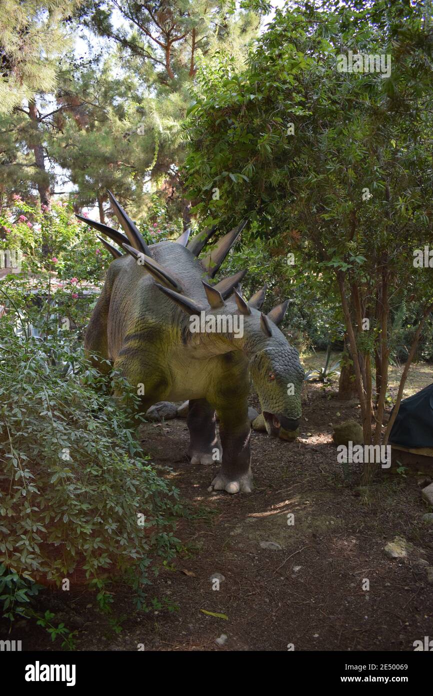 Big model of prehistoric dinosaur stegosaurus in nature. Realistic ...