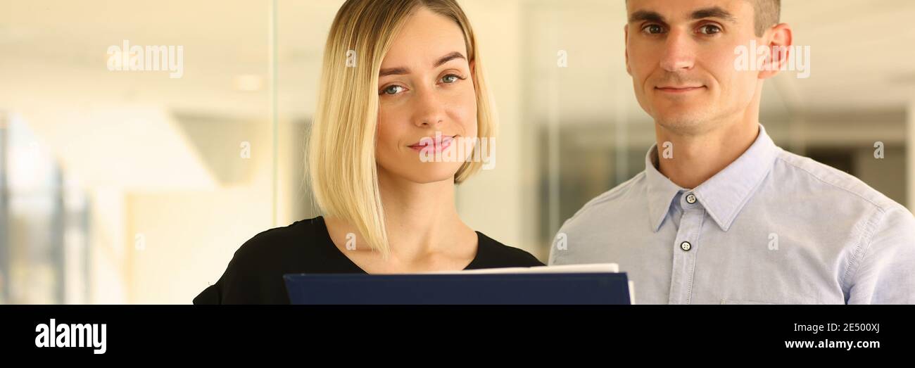 Happy two business partners standing in the office Stock Photo - Alamy