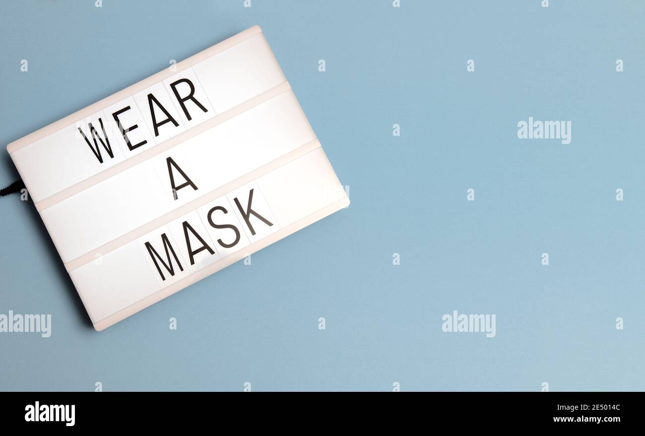 'Wear a Mask' message on a lightbox against a blue background with copy ...