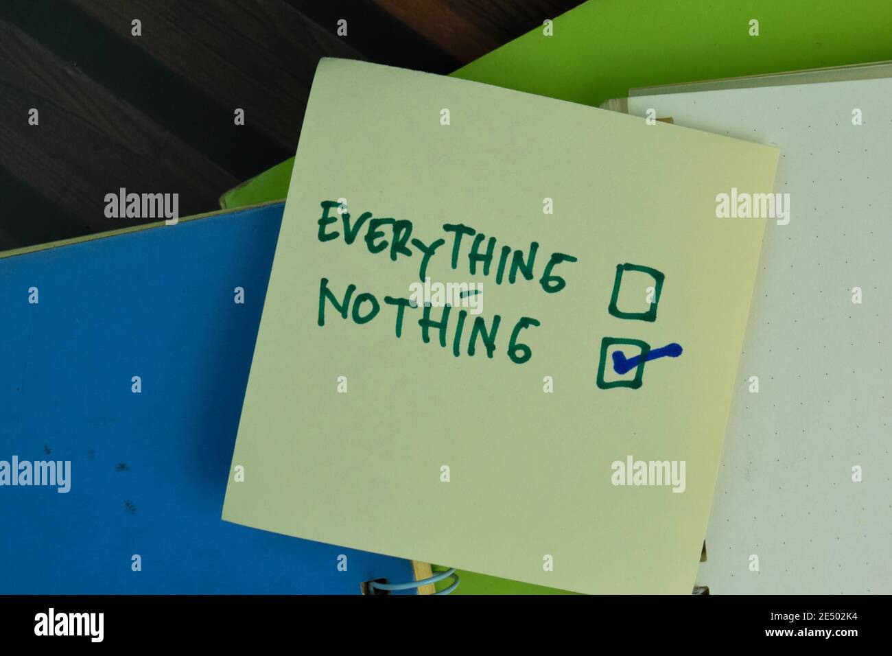Everything and Nothing write on sticky notes and supported by ...