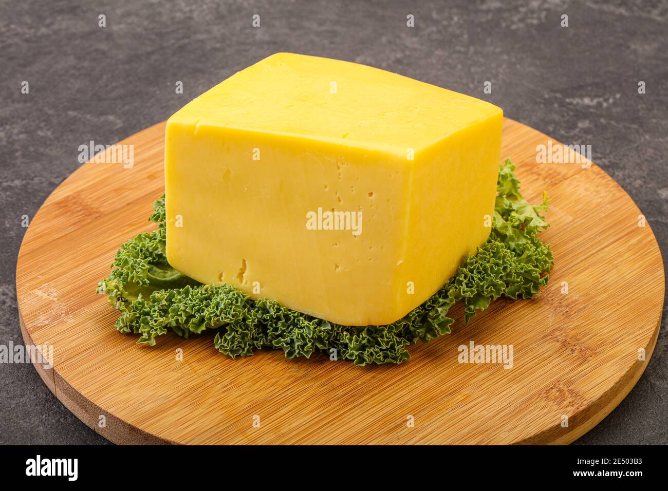 Yellow tilsiter cheese dairy product brick Stock Photo - Alamy
