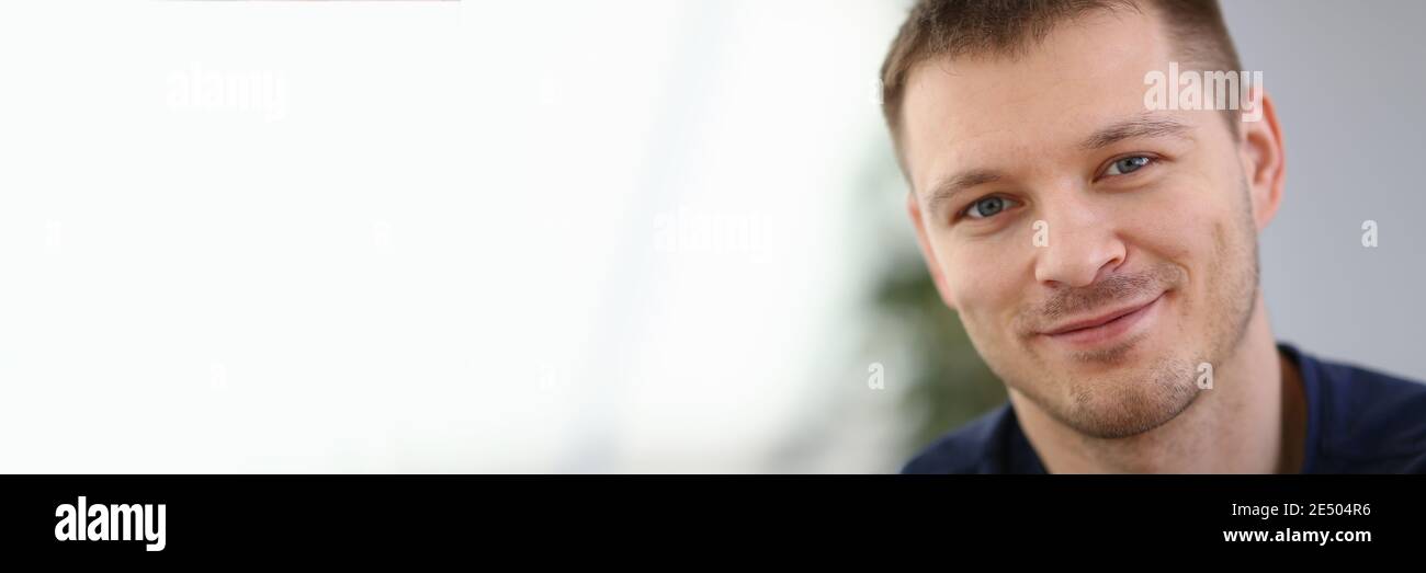 Happy handsome man is looking at camera Stock Photo - Alamy