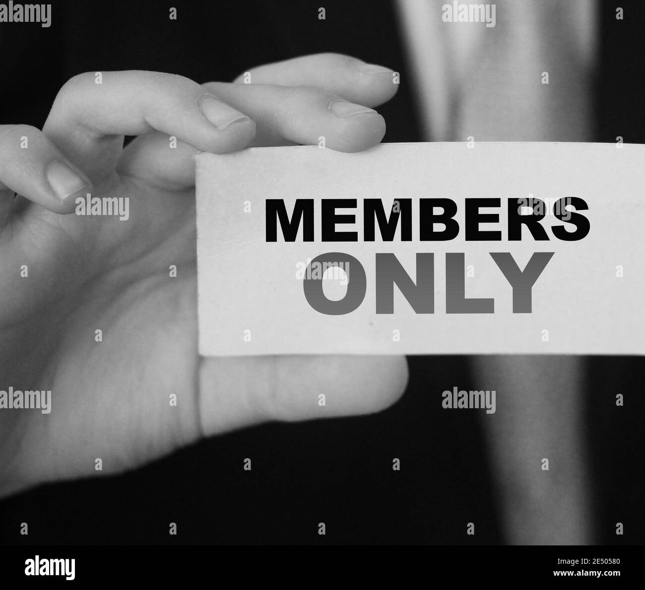 MEMBERS ONLY on a card Businessman holds. VIP clients in business ...
