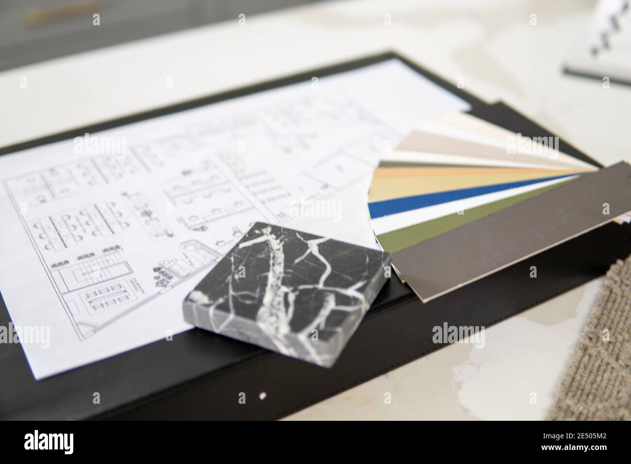 Interior designer's working table, an architectural plan of the house ...