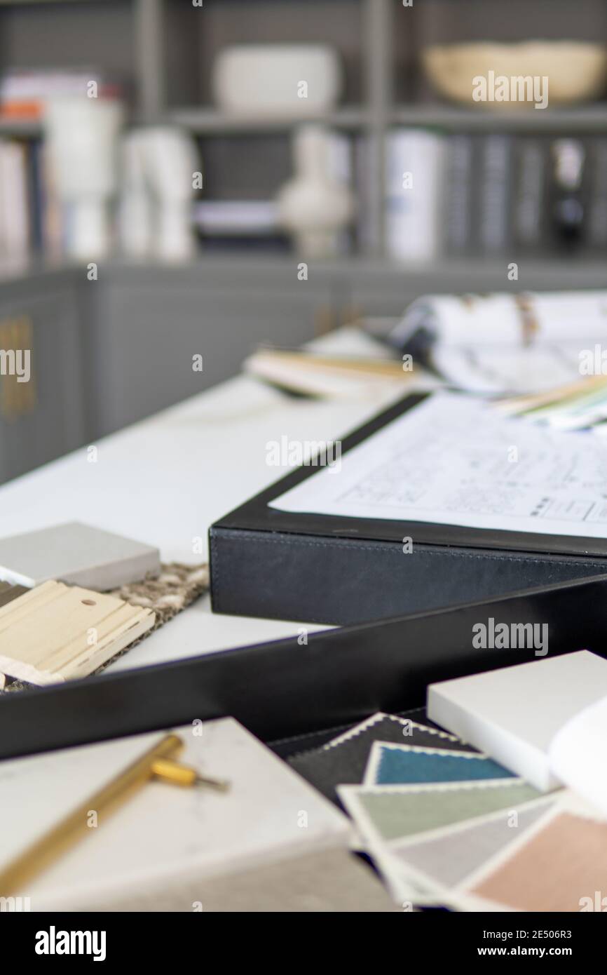 Interior designer's working table, an architectural plan of the house ...