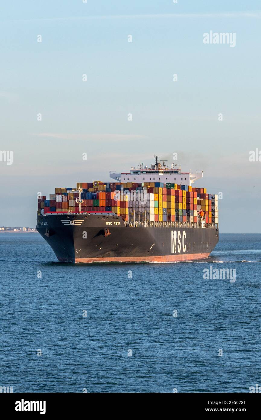 large container ship entering the port of southampton docks in the ...