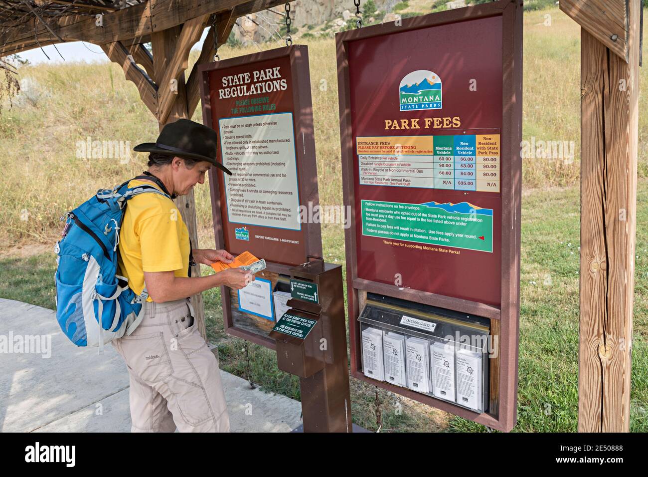 Tourist paying park fees at Pictograph Cave State Park, Billings ...