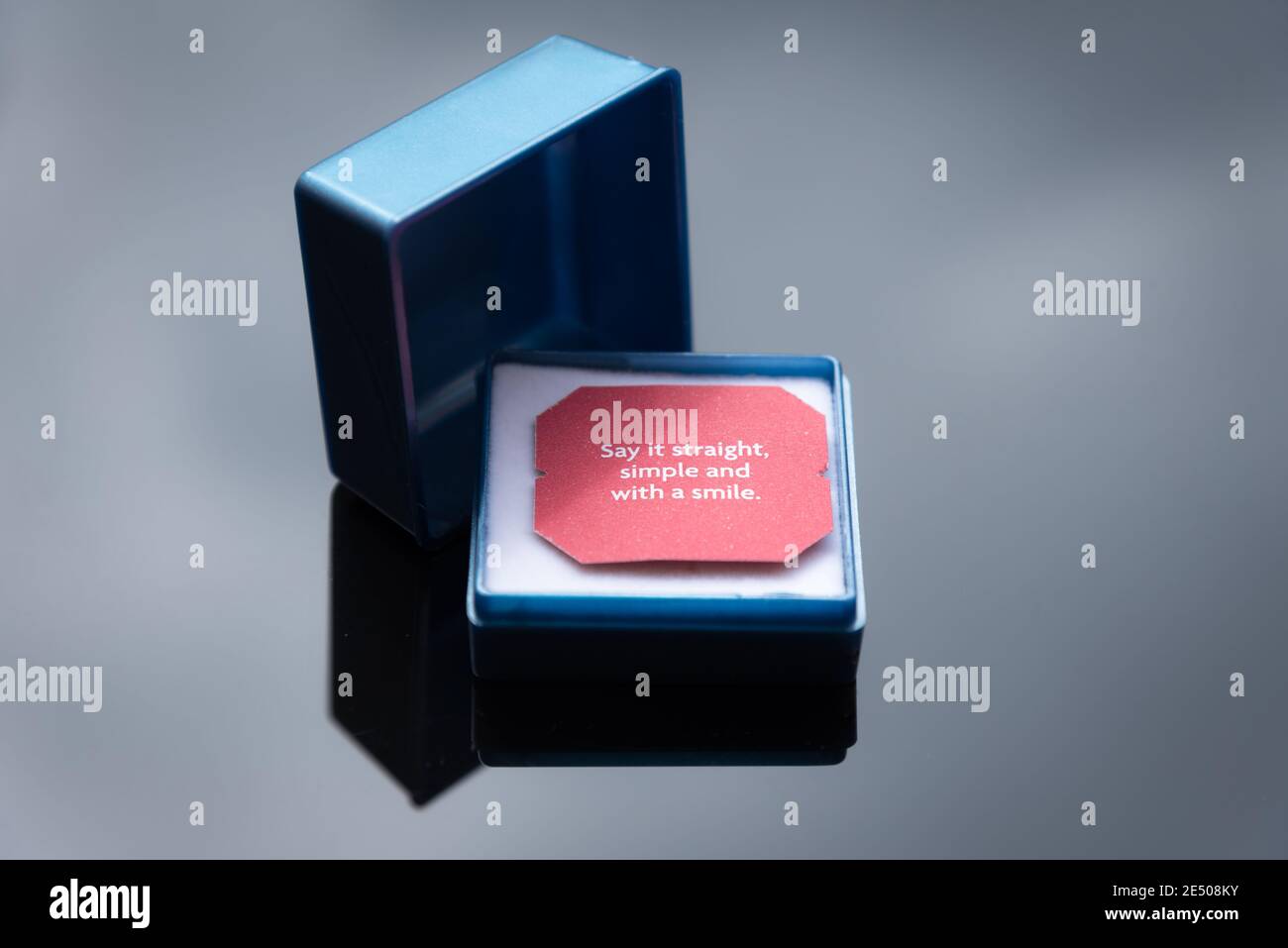 A gift box with a catchy motto Stock Photo - Alamy