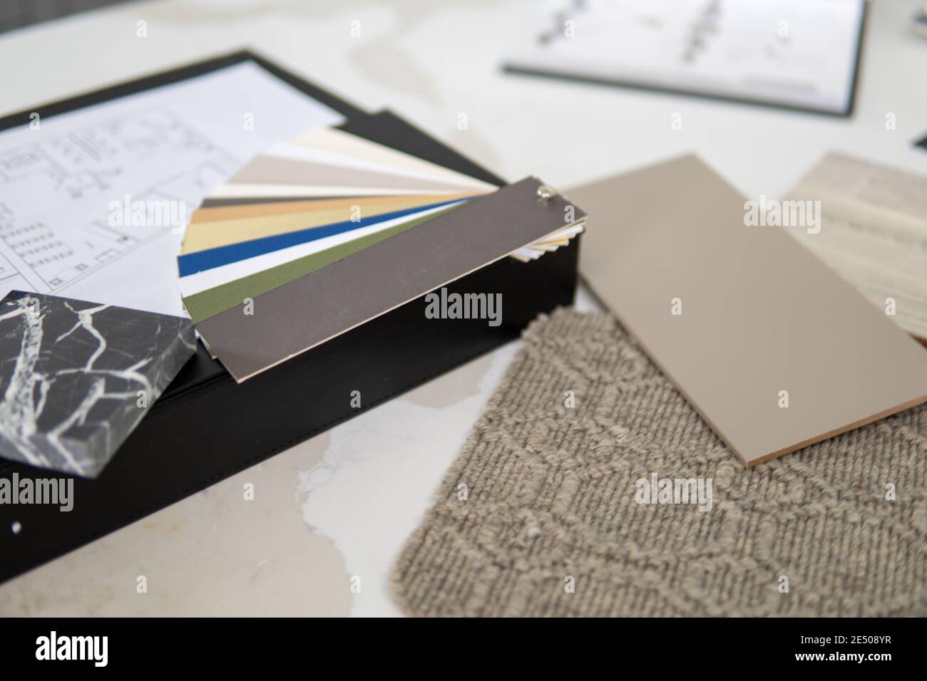 Interior designer's working table, an architectural plan of the house ...