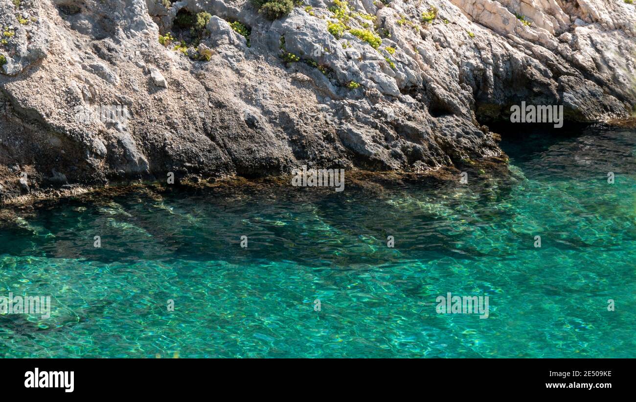 Small bay with crystal clear sea water Stock Photo - Alamy