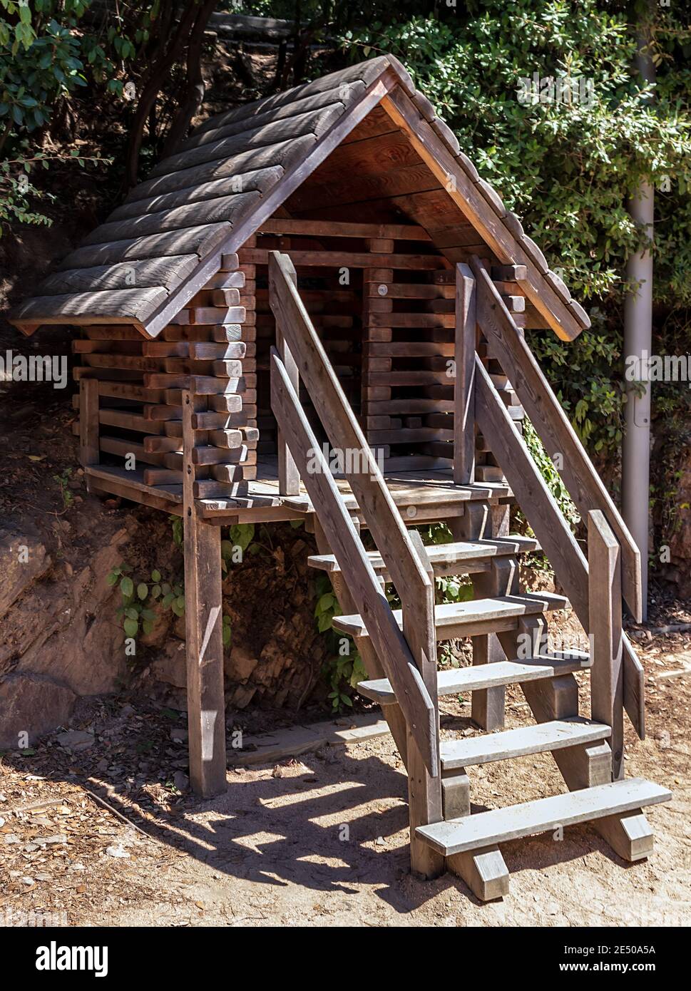 wooden log house playground in the green forest Stock Photo - Alamy