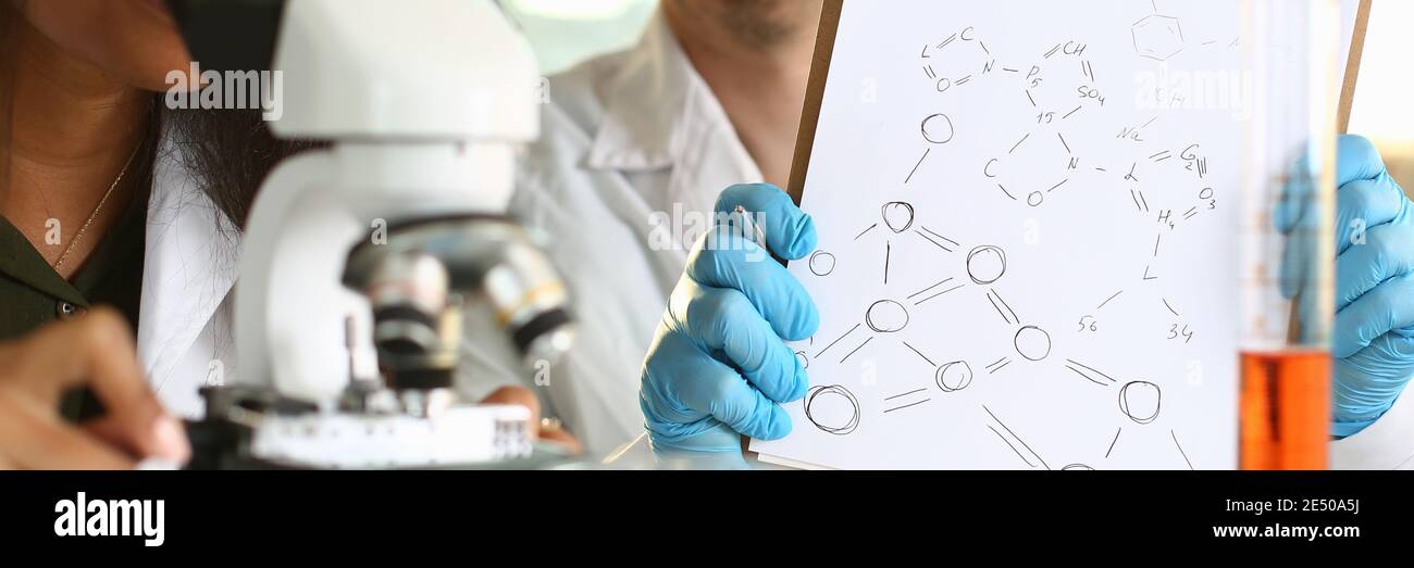 Two scientists conducting chemical research in the laboratory Stock ...