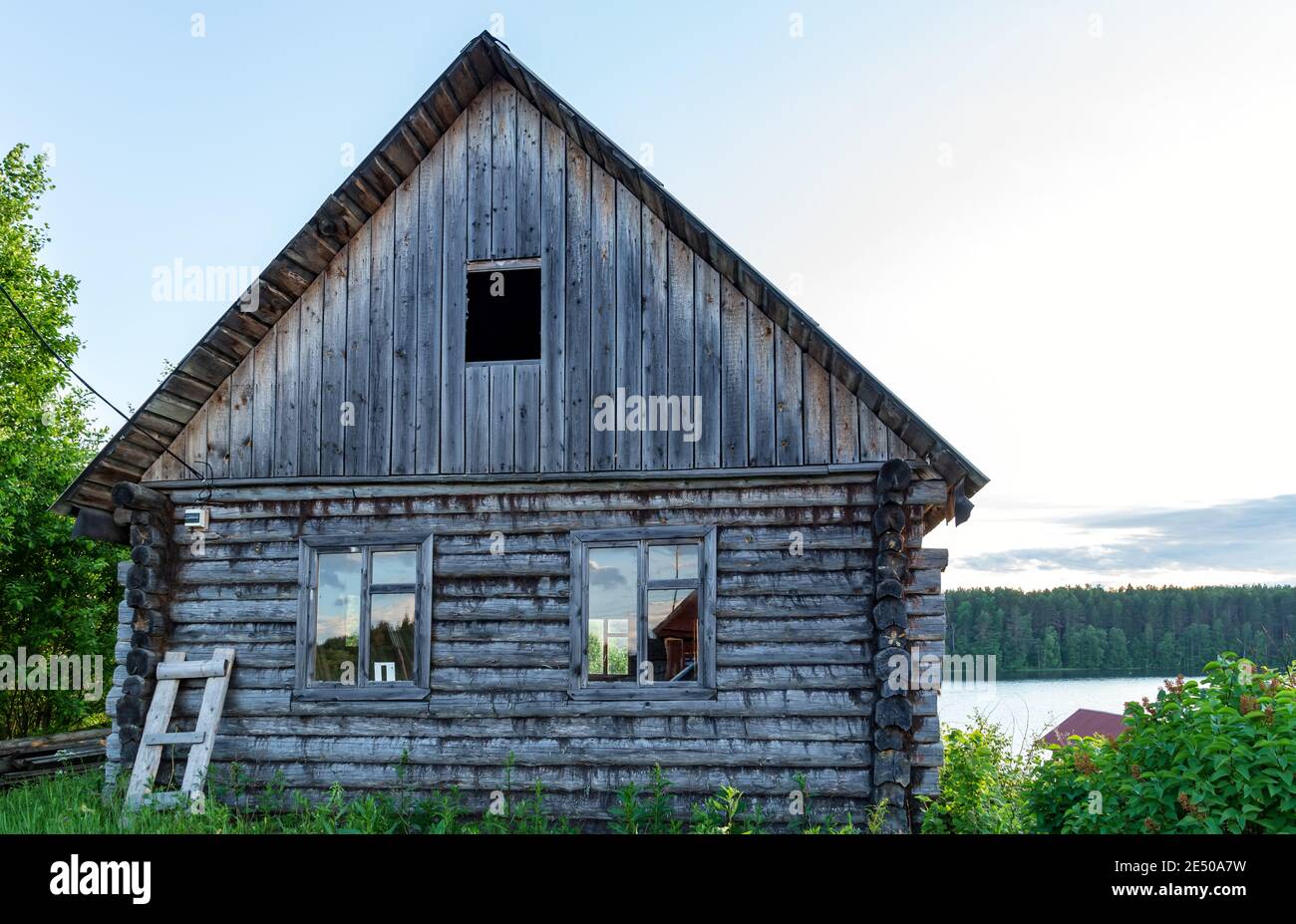 Abandoned wooden log house broken old building scene pond Stock Photo ...
