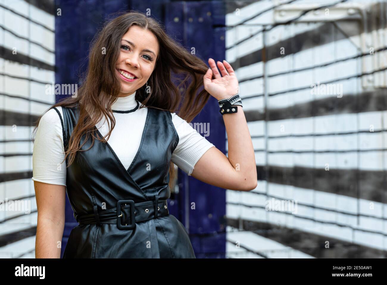 portrait of a young flirty funny woman on the background of a 3d three ...