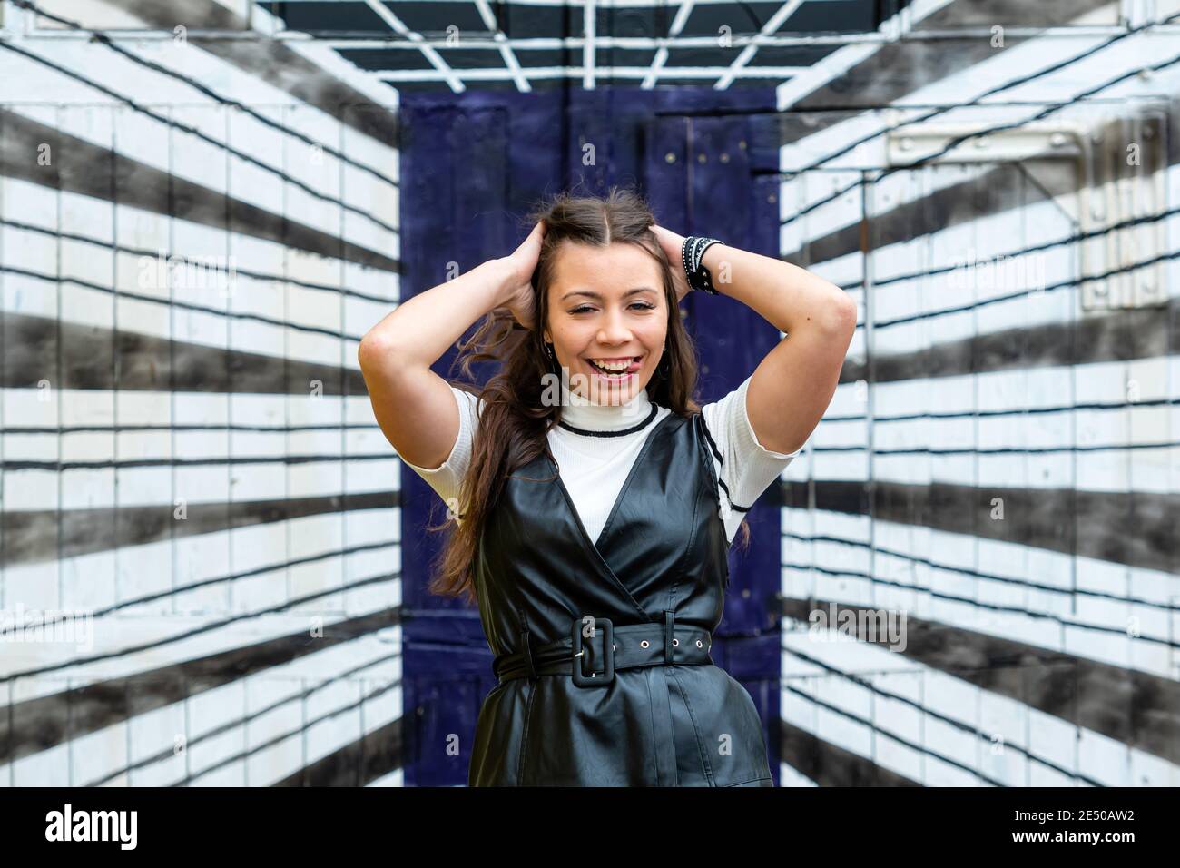 portrait of a young flirty funny woman on the background of a 3d three ...