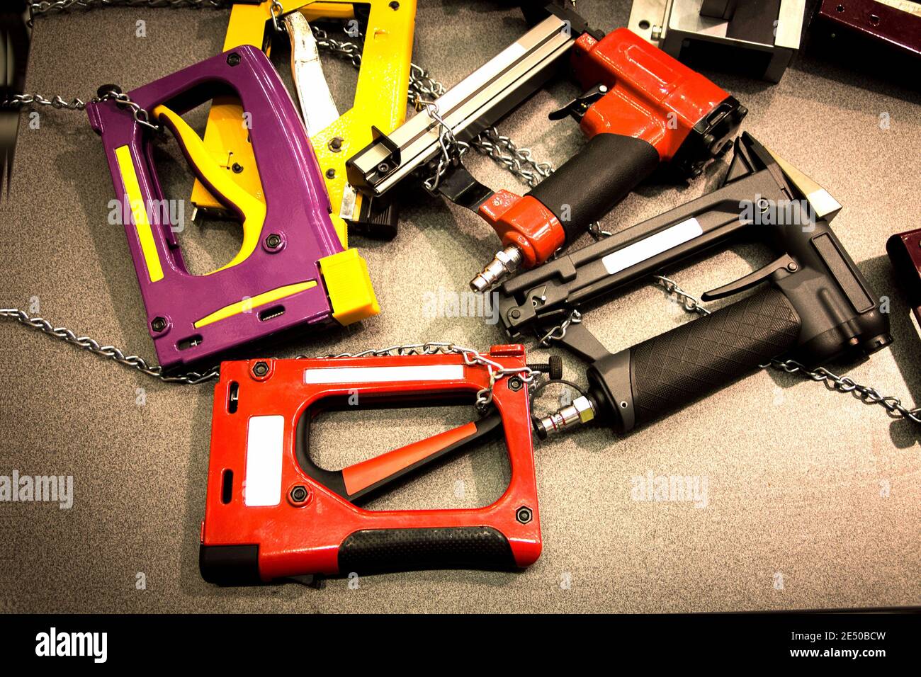 Pneumatic tools set against a dark background Stock Photo - Alamy