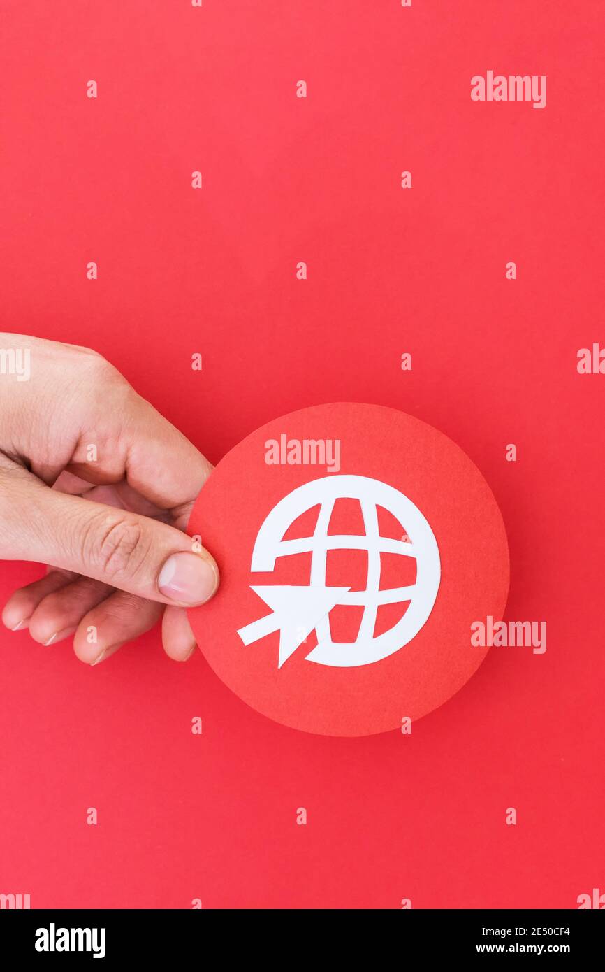 Person holding a small internet globe icon with a cursor isolated on a ...