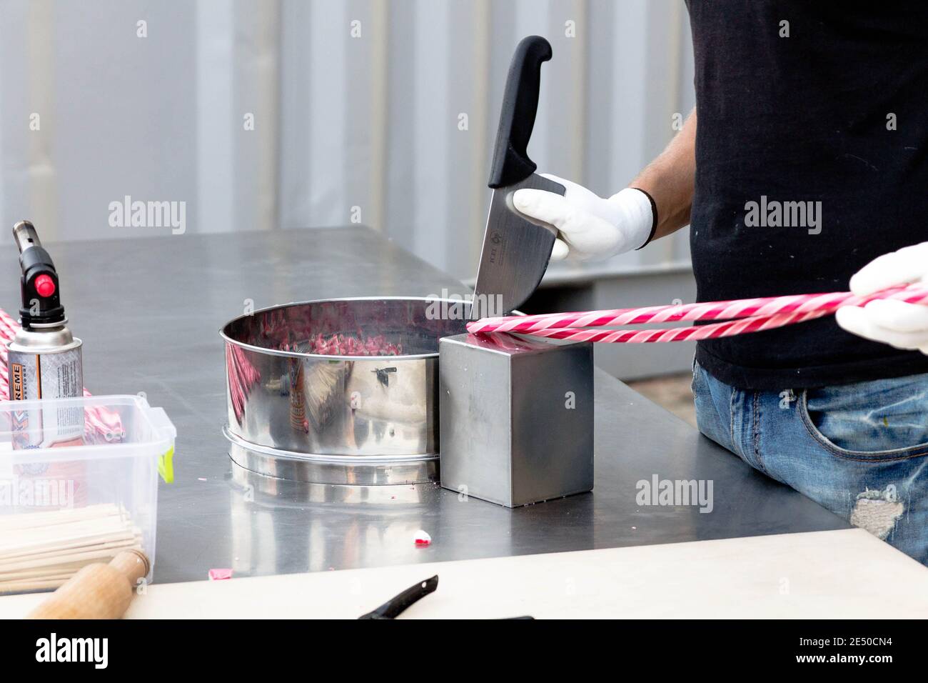 Man makes candy. Preparation lollipops. Making chocolates. Preparation ...