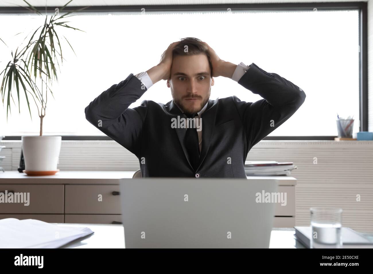 Frustrated man looking laptop screen hi-res stock photography and ...