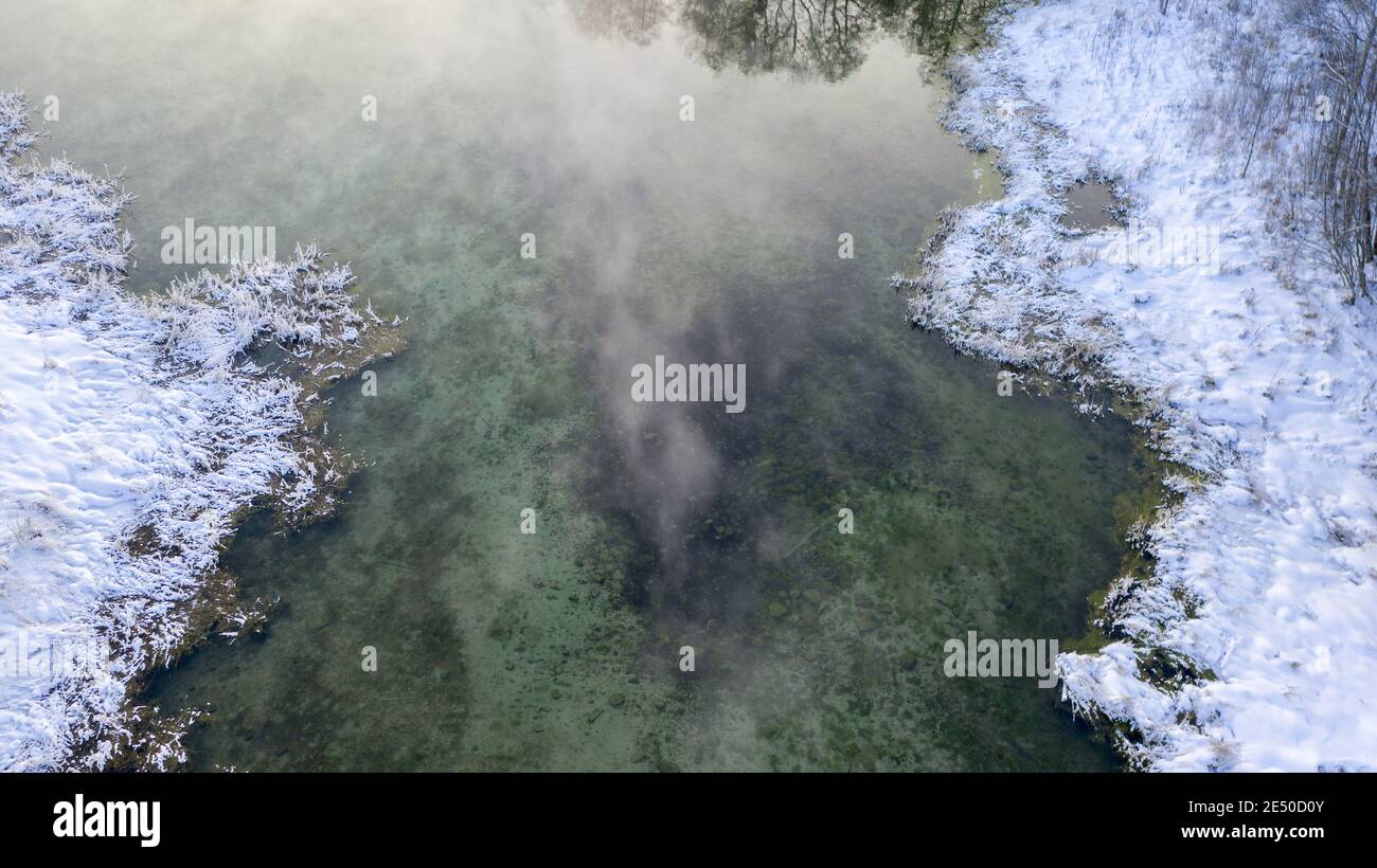 Beautiful scenery of the natural groundwater spring with the heavily ...