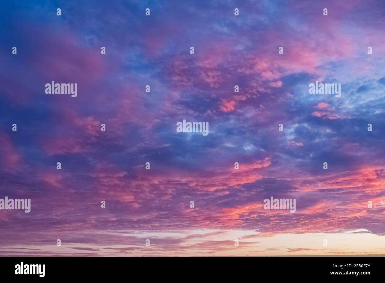 Dramatic sunset sky in red and blue colors Stock Photo - Alamy