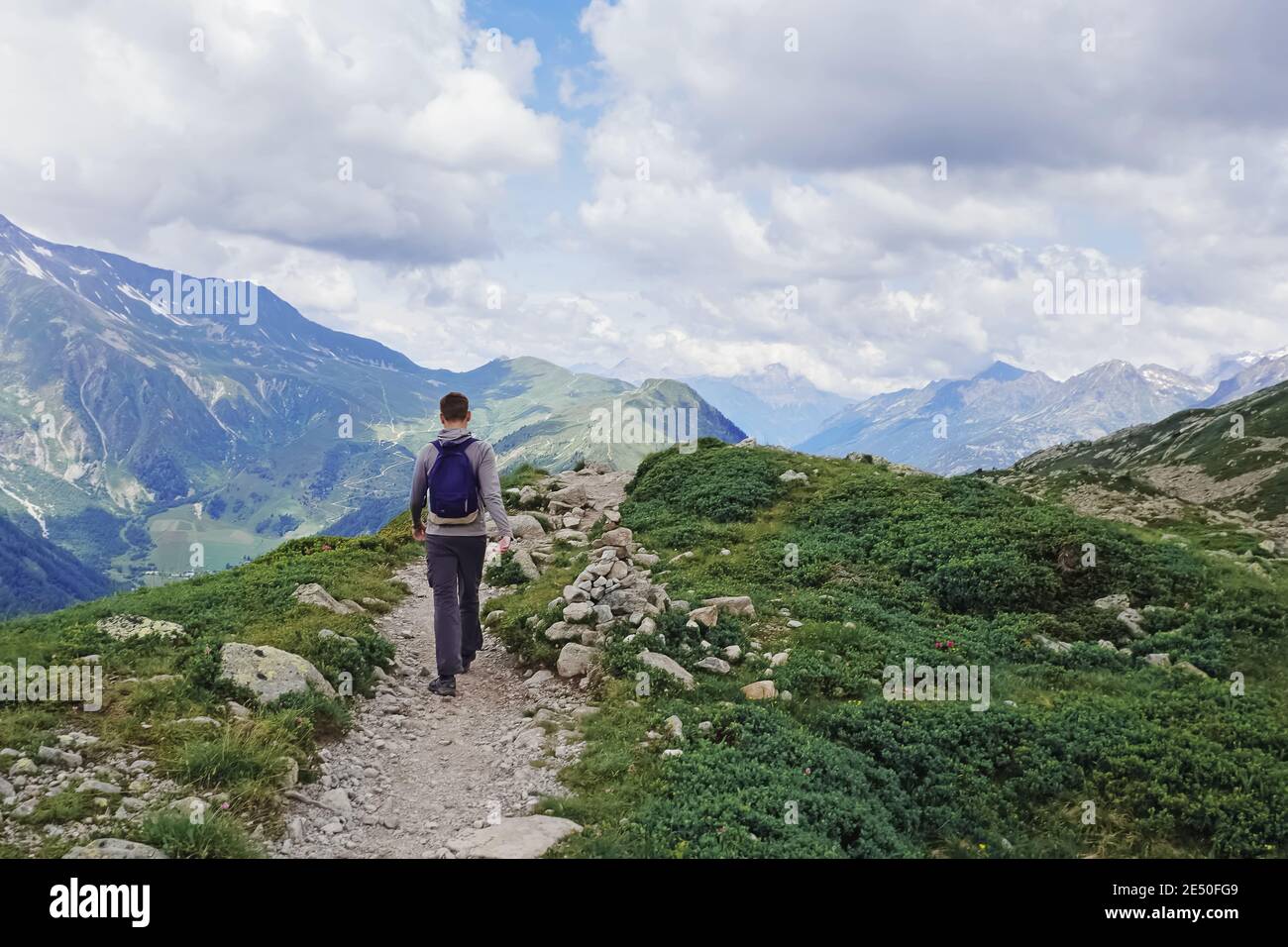 Back view traveler backpack walking hi-res stock photography and images ...