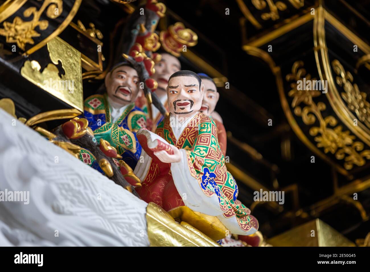 Close up of a japanese group of colorful decorative porcelain statues ...