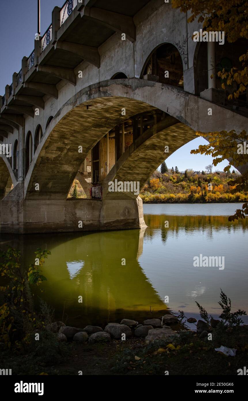 Vertical low angle shot of the understructure and pillars of a bridge ...