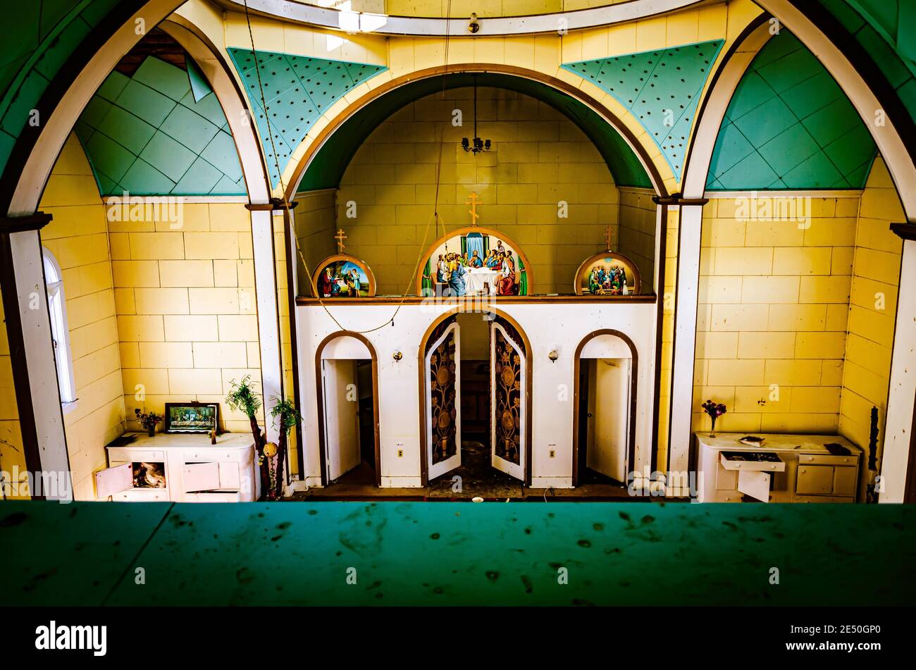 High angle shot of the altar of a church with yellow and green walls ...