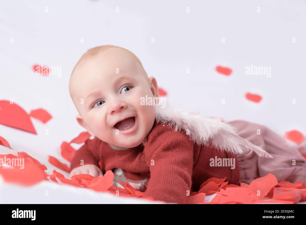 cute little baby with heart in hands. happiness and people concept ...