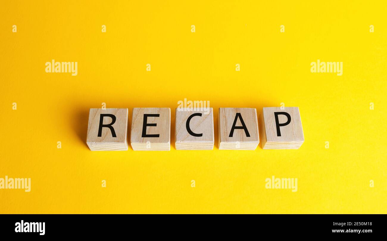 Wooden blocks with the word Recap. A document presenting your skills ...
