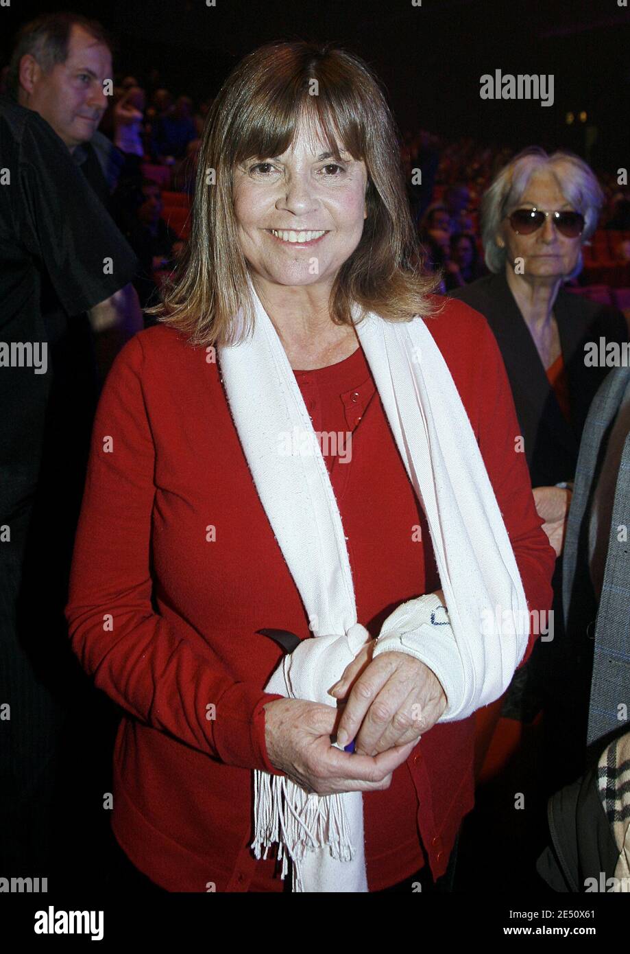 Singer Chantal Goya, sporting a blaster on her left arm, attends the ...