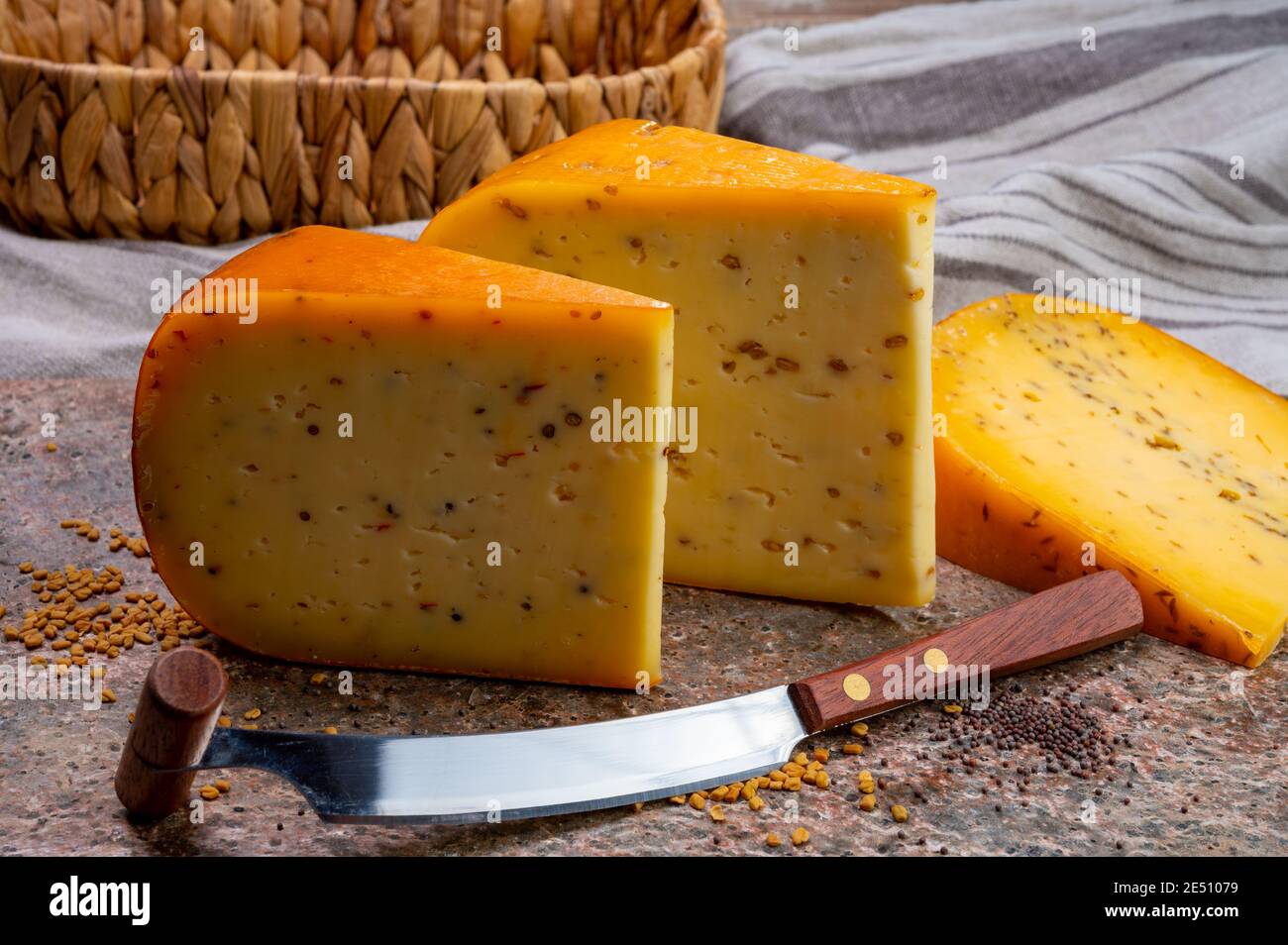 Cheese collection, pieces of hard yellow Dutch gouda cheese with dried ...