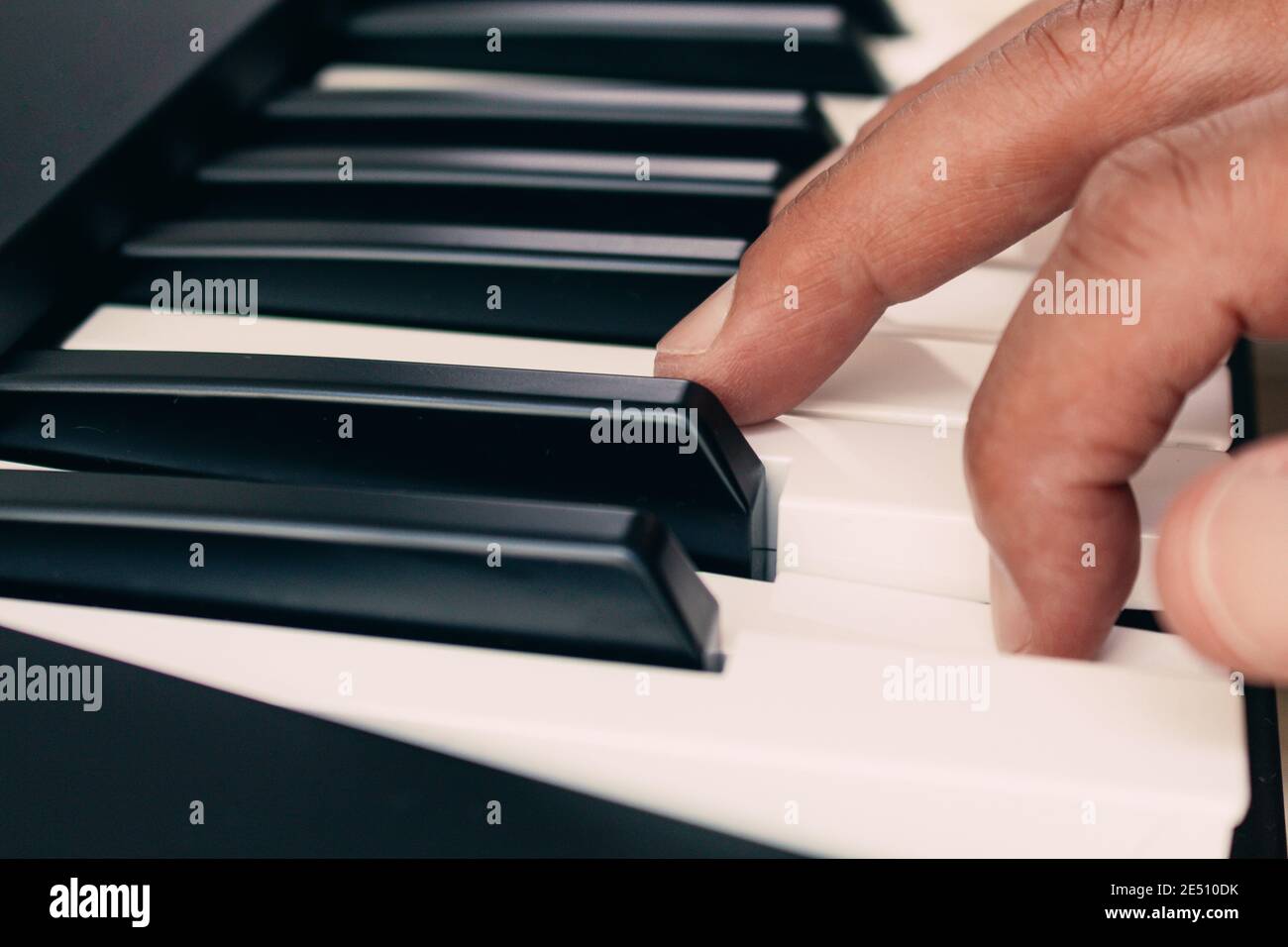 Piano and pianist, learning piano with app with tablet Stock Photo - Alamy