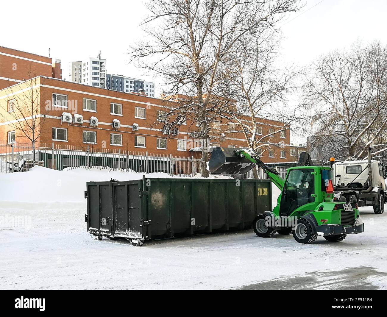 Moscow. Russia. January 15, 2021. Small front-end loaders clear snow ...