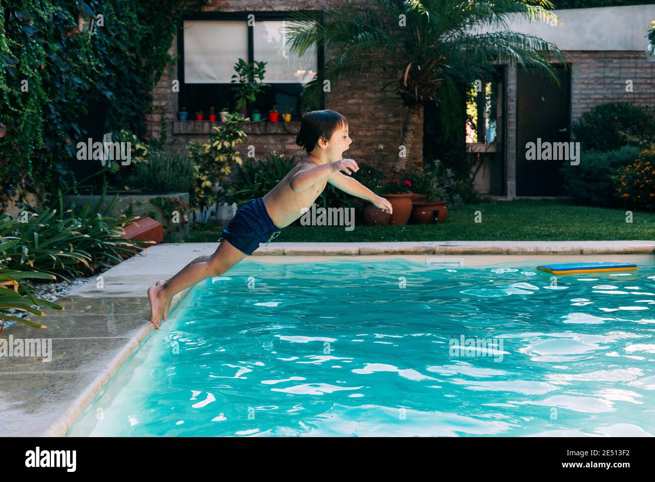 Little kid jumping swimming pool hi-res stock photography and images ...