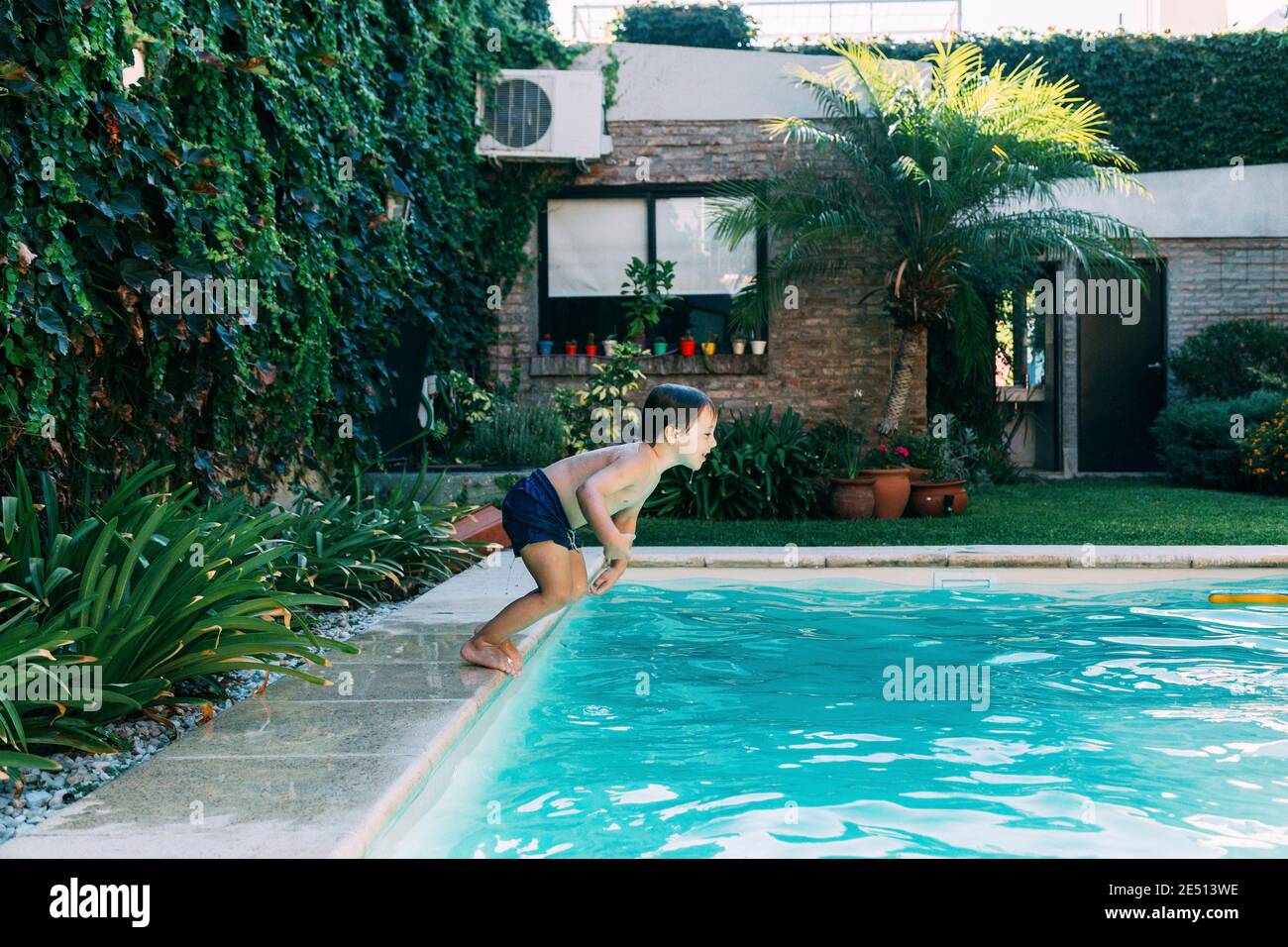 Swimming pool jumping into swimming pool hi-res stock photography and ...