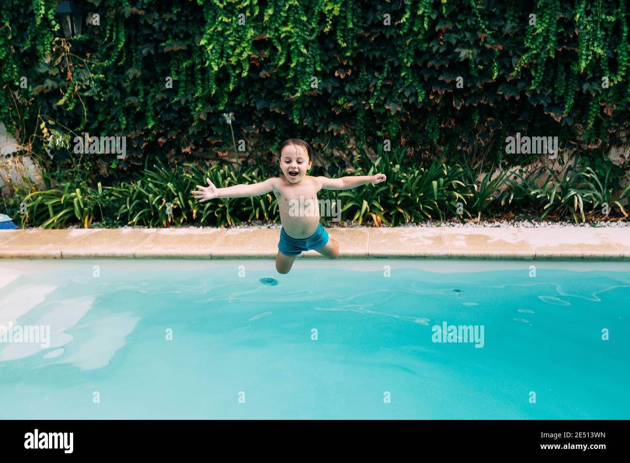 Little kid jumping swimming pool hi-res stock photography and images ...