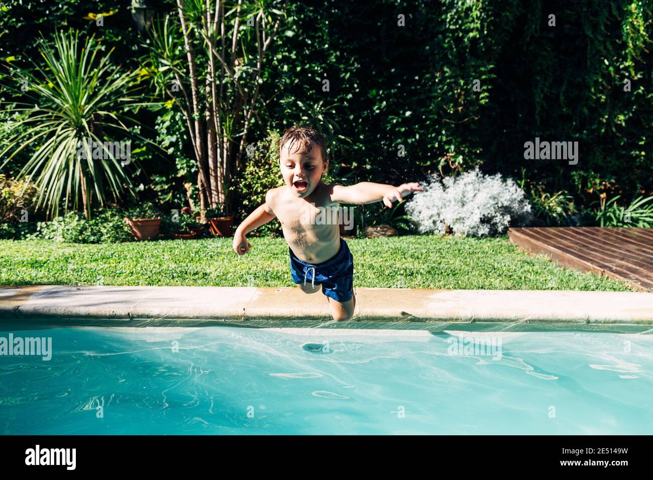 Child jumping into water hi-res stock photography and images - Alamy