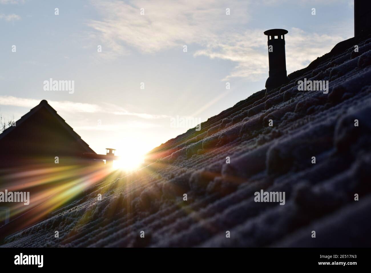 Sunrise over house roof hi-res stock photography and images - Alamy