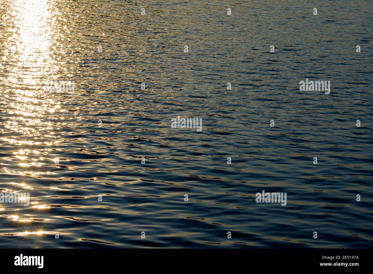 Sun reflection in flowing water Stock Photo - Alamy