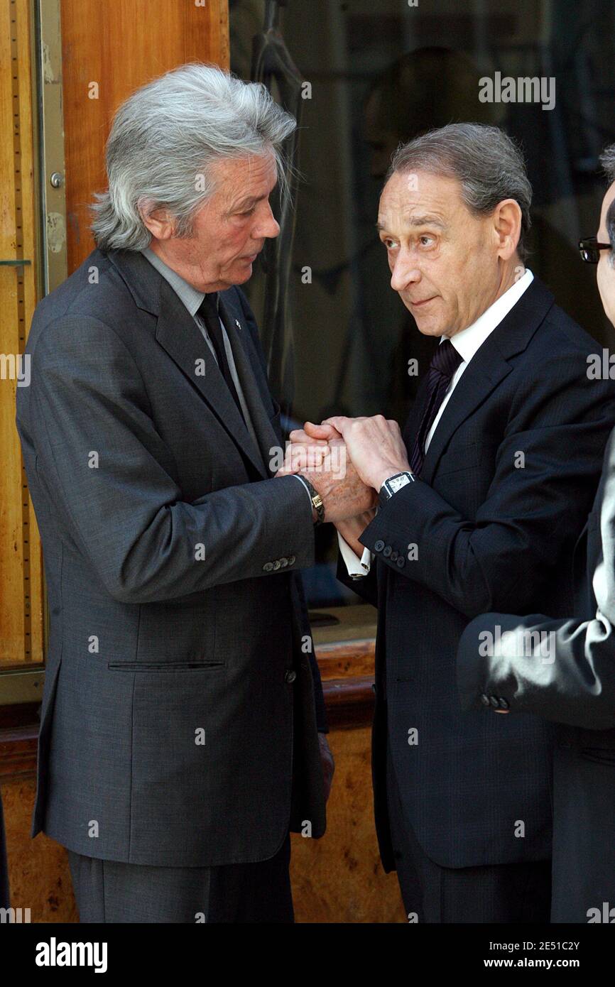 Paris Mayor Bertrand Delanoe and Alain Delon arrive for a service to ...