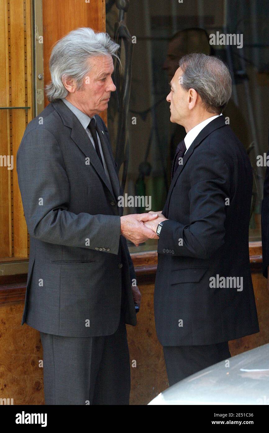 Paris Mayor Bertrand Delanoe and Alain Delon arrive for a service to ...