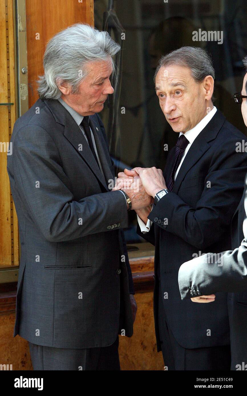 Paris Mayor Bertrand Delanoe and Alain Delon arrive for a service to ...