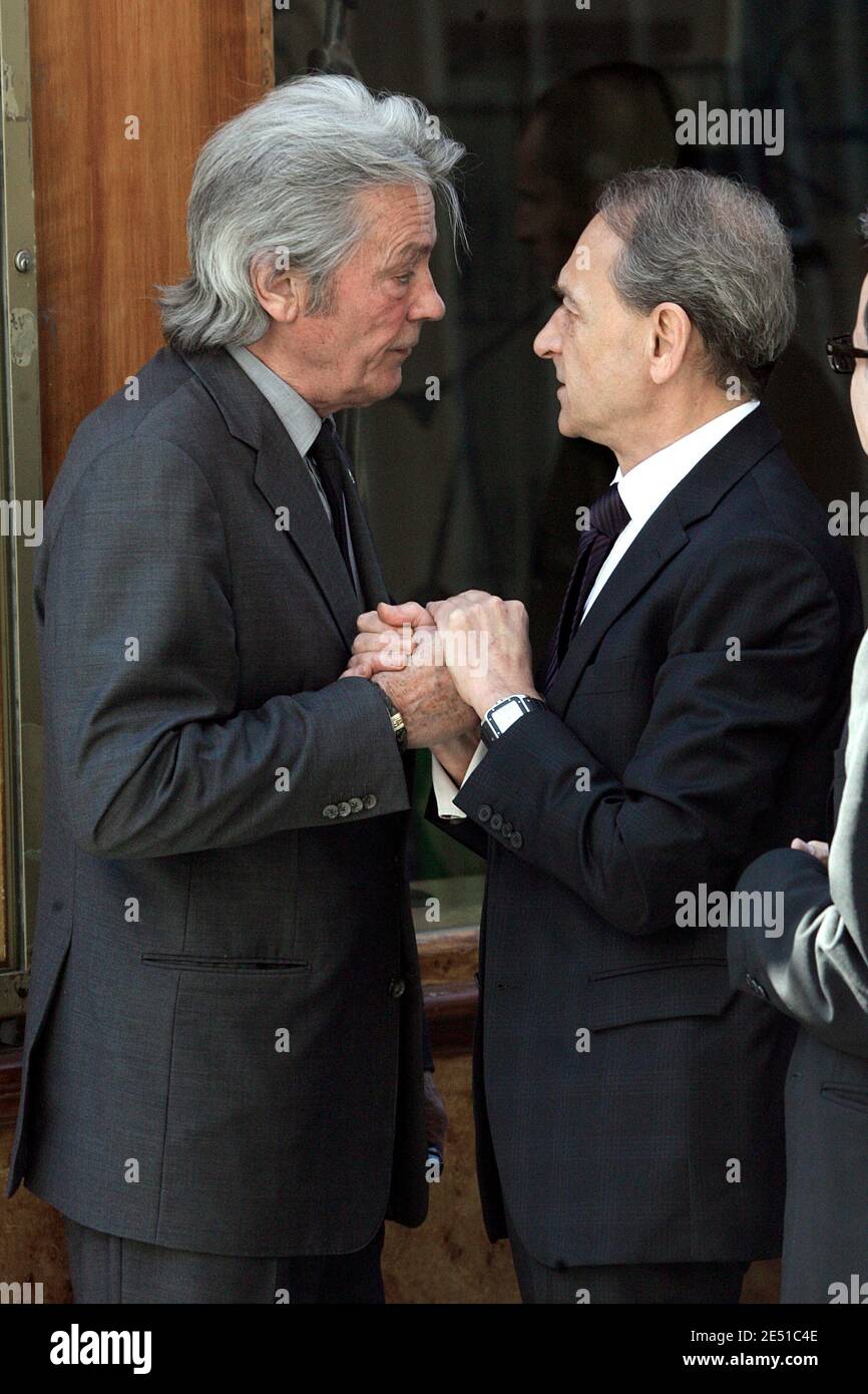Paris Mayor Bertrand Delanoe and Alain Delon arrive for a service to ...