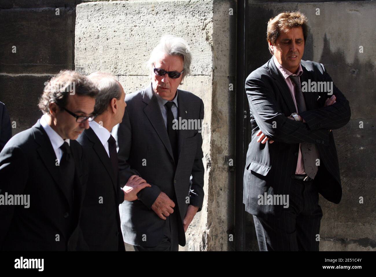 Paris Mayor Bertrand Delanoe and Alain Delon arrive for a service to ...