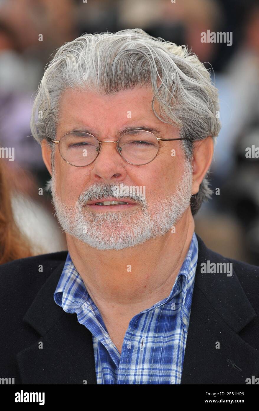 Director and producer George Lucas poses at a photocall for the film ...
