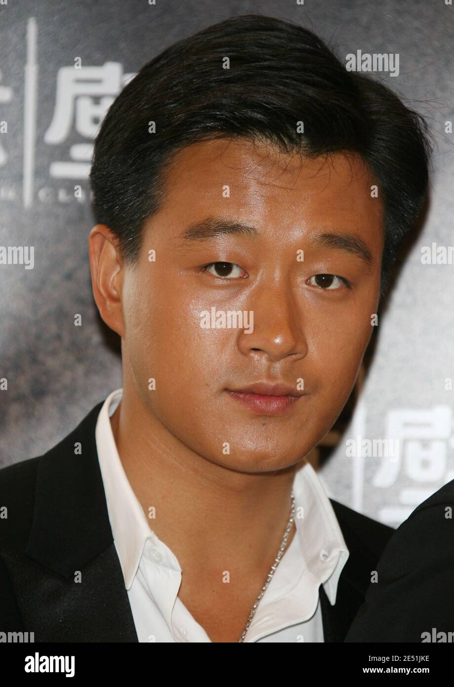 Cast member Tong Dawei poses at a photocall for the film 'Red Cliff ...